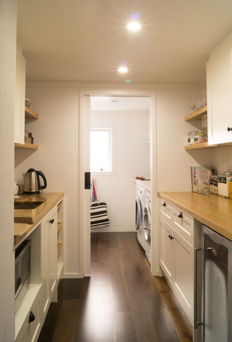 Self-closing Cavity Slider Divides Kitchen and Laundry Spaces – EBOSS