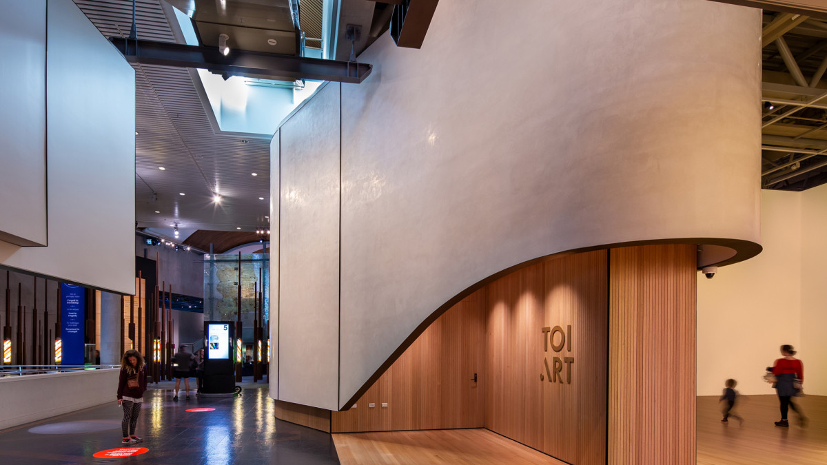 Luminous Curved Plaster Wall Welcomes Visitors to – EBOSS