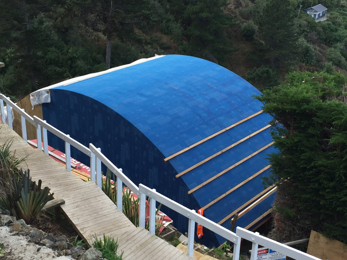 Unique Curved Roof Protected with High-Performance Building Wrap – EBOSS